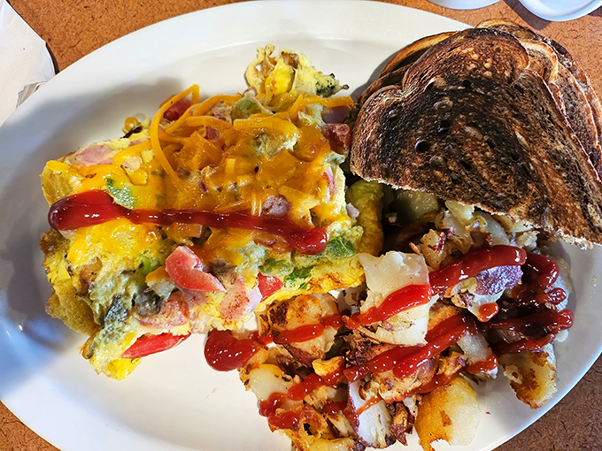 This omelet brings vegetables to the breakfast party and everyone's having a good time. That toast on the side? The perfect supporting actor.
