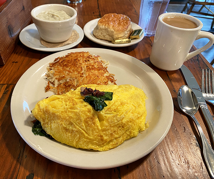 This fluffy yellow omelet with crispy hash browns and homemade biscuit is what breakfast dreams are made of&mdash;simple perfection.