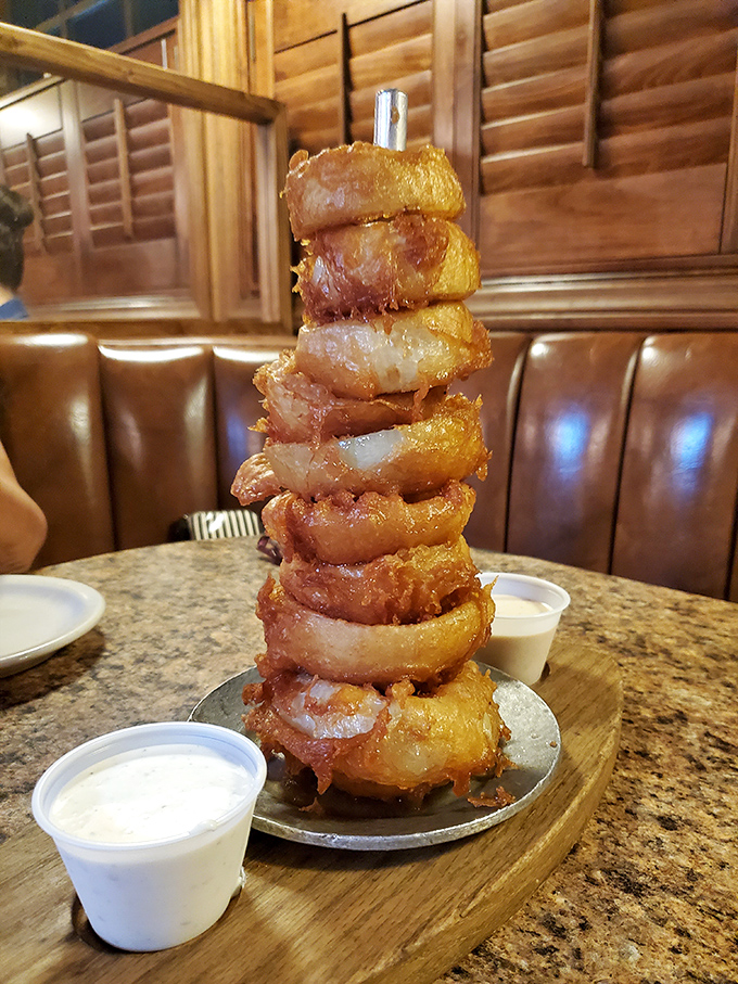 The onion ring tower &ndash; architecture you can eat! Each golden ring stacked like a delicious Jenga game waiting to be dismantled.