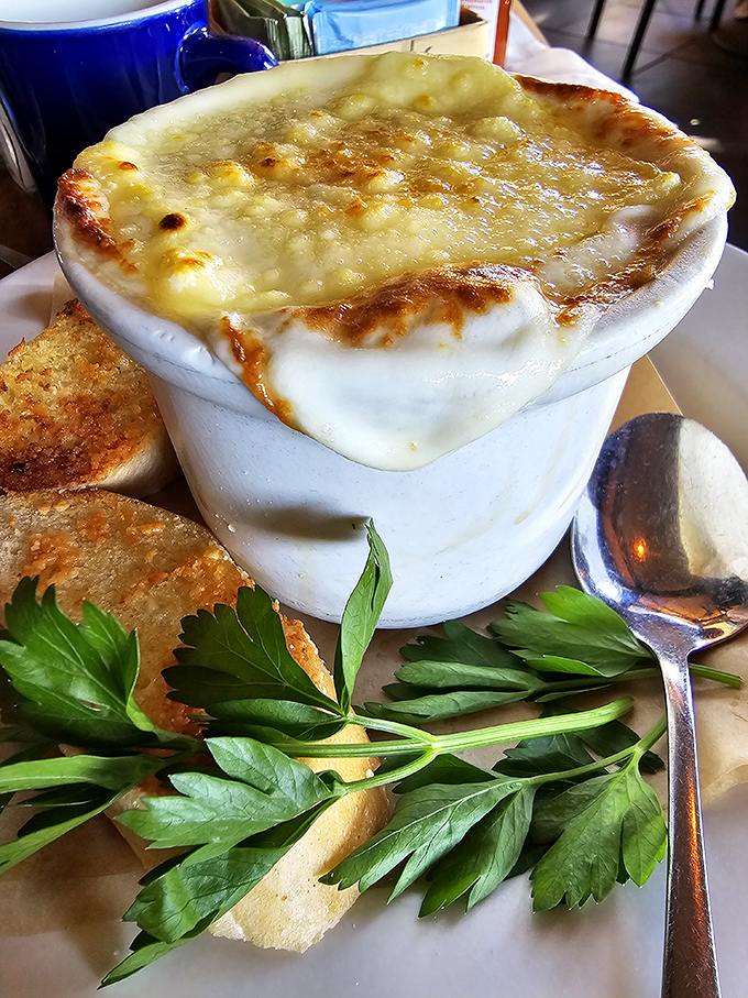 This isn't just onion soup&mdash;it's a warm hug in a bowl, with a cheese blanket tucked in for good measure.