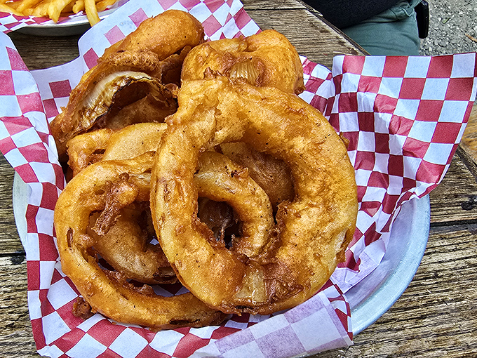Golden onion rings so perfectly crispy they could make a grown person weep tears of pure joy.