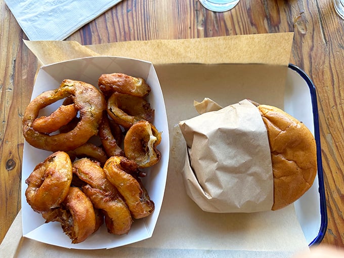 These aren't just onion rings; they're golden halos of crispy perfection that make you wonder why anyone bothers with fancy appetizers.