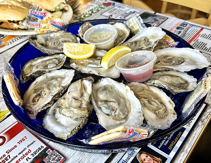 Oysters on the half shell arranged like jewels on a blue plate &ndash; nature's perfect appetizer with just a squeeze of lemon and a dash of anticipation.