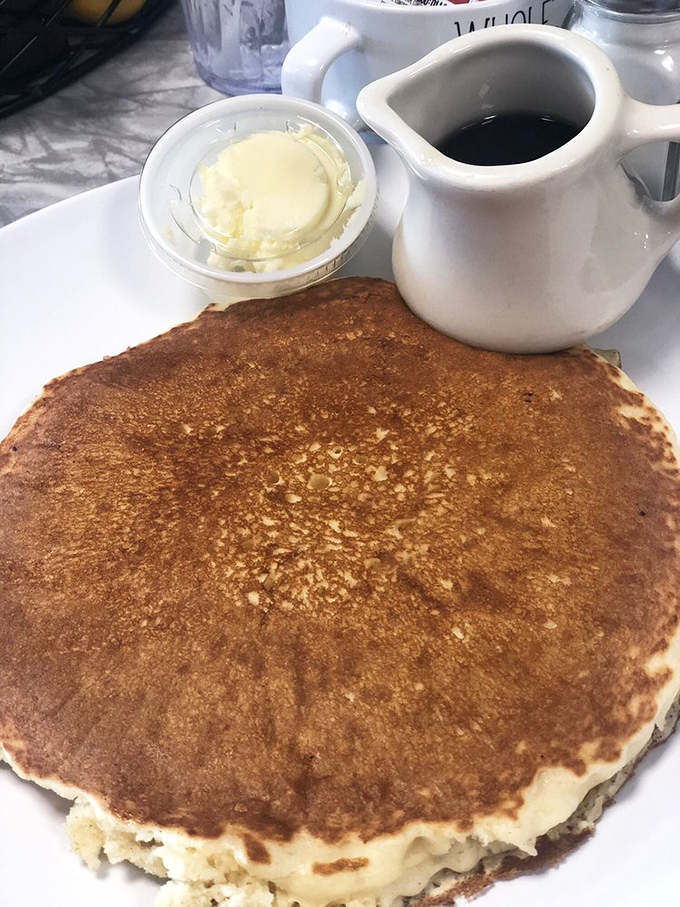 This isn't just a pancake—it's a golden canvas of possibility. Butter melting into those perfect bubbles like nature intended.