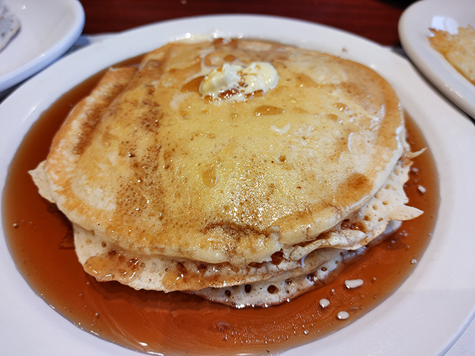 These golden pancakes aren't just breakfast&mdash;they're edible sunshine. The perfect butter-to-syrup ratio suggests someone in that kitchen really cares about your happiness.