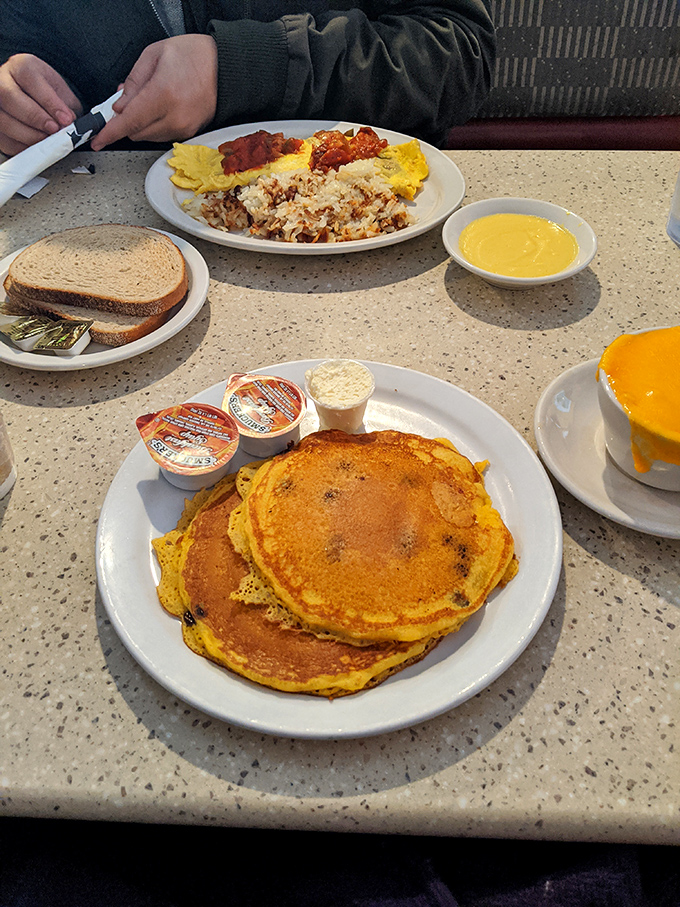 A stack of pancakes alongside eggs and hash browns&mdash;the breakfast equivalent of winning the lottery. Morning glory on a plate.