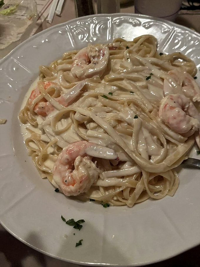 Linguine bathed in silky cream sauce cradles plump shrimp &ndash; a dish that answers the eternal question: "What would happiness look like if it were pasta?"