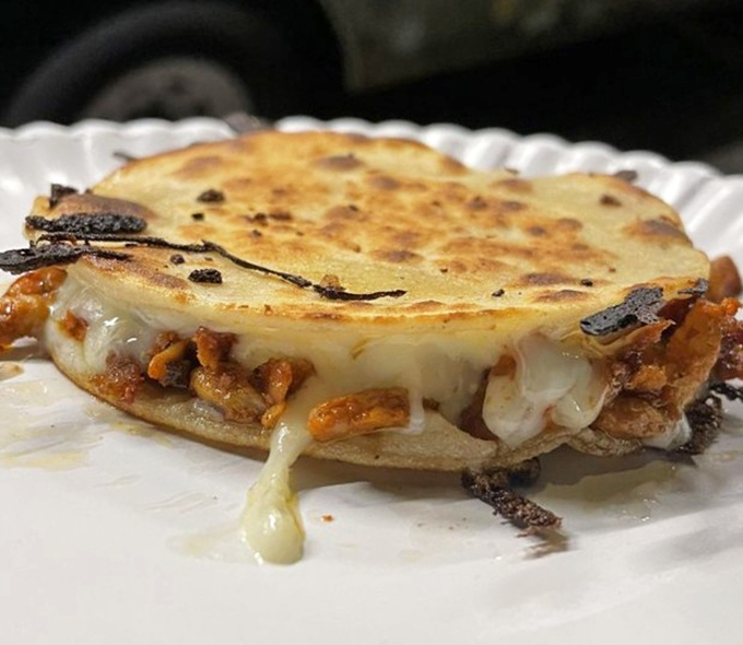 The mulita—Mexico's answer to the grilled cheese sandwich—with melted cheese and pastor pork creating a flavor bomb that defies its humble appearance.