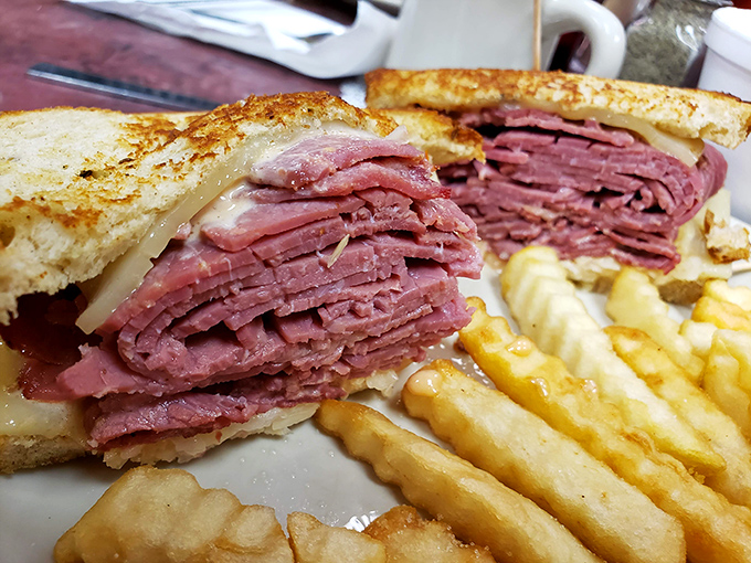 This pastrami sandwich isn't just stacked &ndash; it's architectural. The Empire State Building of lunch options, with fries as worthy sidekicks. 