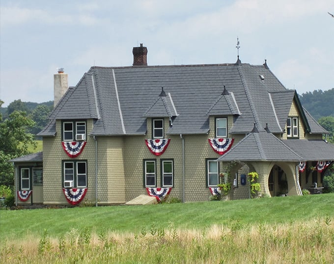 Patriotic bunting turns this historic home into America's most dignified Fourth of July celebration ever.