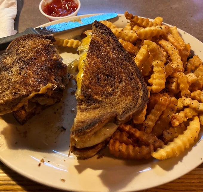 The humble patty melt—proof that sometimes the best things in life happen when beef meets cheese between two slices of grilled perfection.