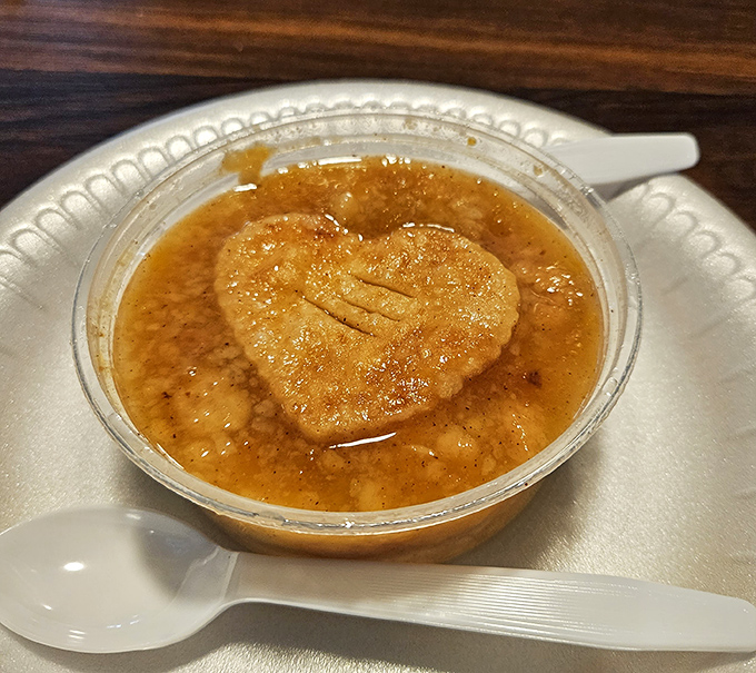 This isn't just peach cobbler—it's Georgia in a cup, complete with a heart-shaped crust that says "we put love in this dessert."