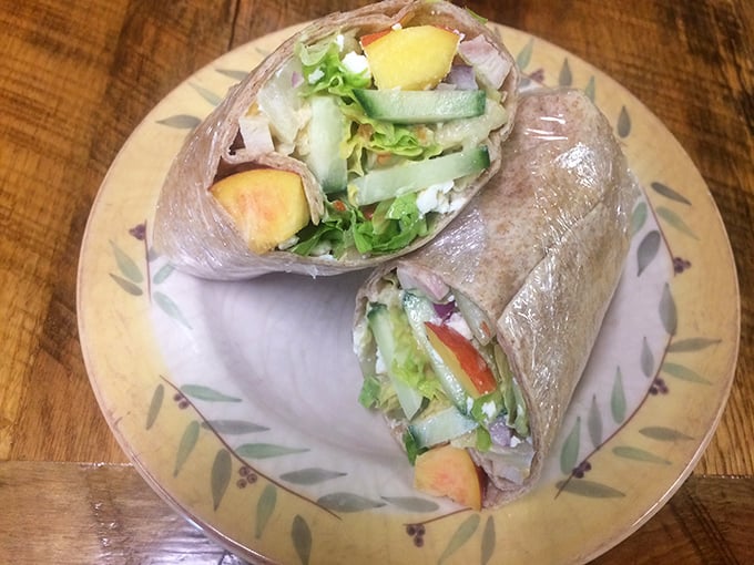 The Peach Wrap in its natural habitat&mdash;fresh ingredients nestled together like old friends at a reunion, ready to make your taste buds join the party.