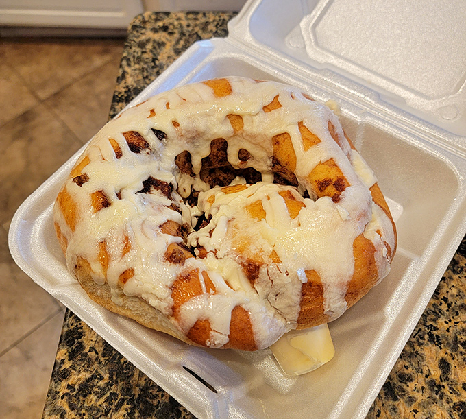 To-go packaging that barely contains the magnificence. Even in a takeout container, this cinnamon roll maintains its rightful status as breakfast royalty.