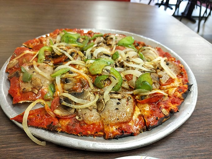 A symphony of toppings on a canvas of perfect crust. This isn't just pizza&mdash;it's edible art with mushrooms playing the lead role.