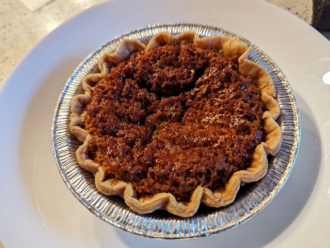 Buttermilk pie in its humble aluminum vessel. Don't let appearances fool you&mdash;this southern-inspired dessert delivers the perfect sweet finale.