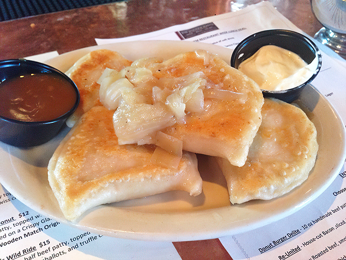 Pierogies so perfectly golden they belong in Fort Knox. These pillowy potato pockets swimming in butter and onions are Pennsylvania comfort in its purest form.