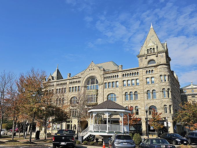 Fort Piqua Plaza houses the public library, proving that books deserve palatial surroundings too. Reading feels more regal when surrounded by limestone grandeur.