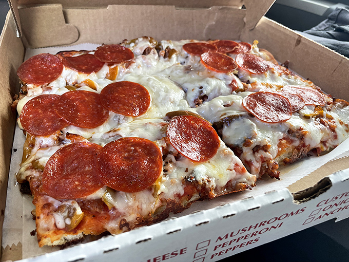 The rectangular pepperoni pizza reveals its Old Forge heritage immediately&mdash;crispy-bottomed, chewy-centered, with that distinctive cheese blend that locals defend passionately.