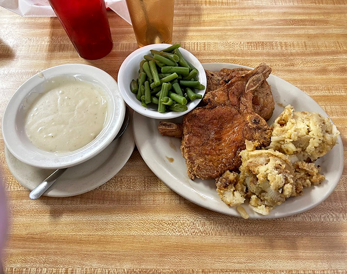 A pork chop dinner that proves vegetables aren't just plate decorations &ndash; they're worthy companions to perfectly seasoned meat and homestyle stuffing.