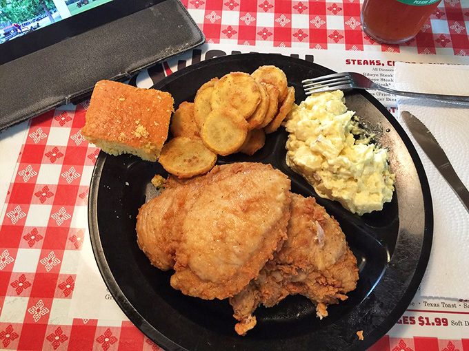Southern comfort on a plate: golden fried chicken, crispy squash medallions, and cornbread that could make a grown person weep with joy.