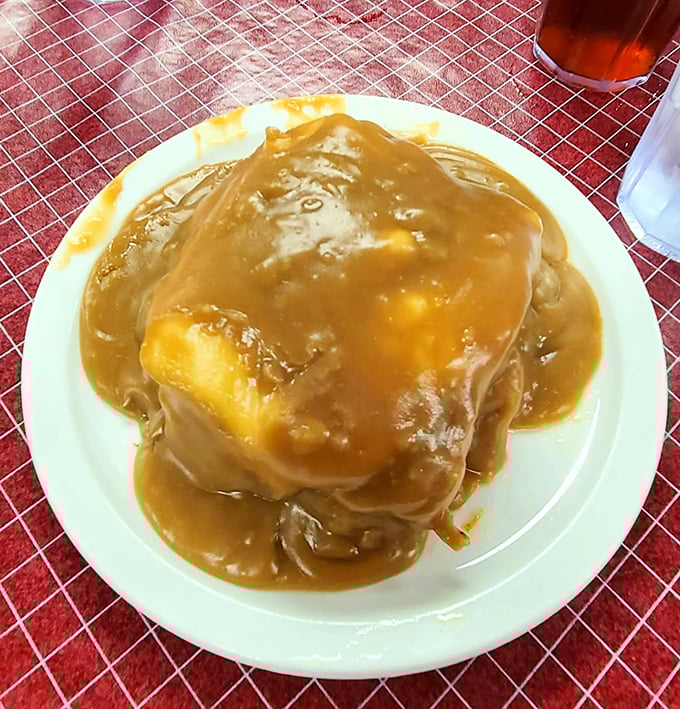 Behold the mighty Hot Manhattan&mdash;tender meat and bread islands swimming in a gravy ocean that would make Neptune himself jealous.