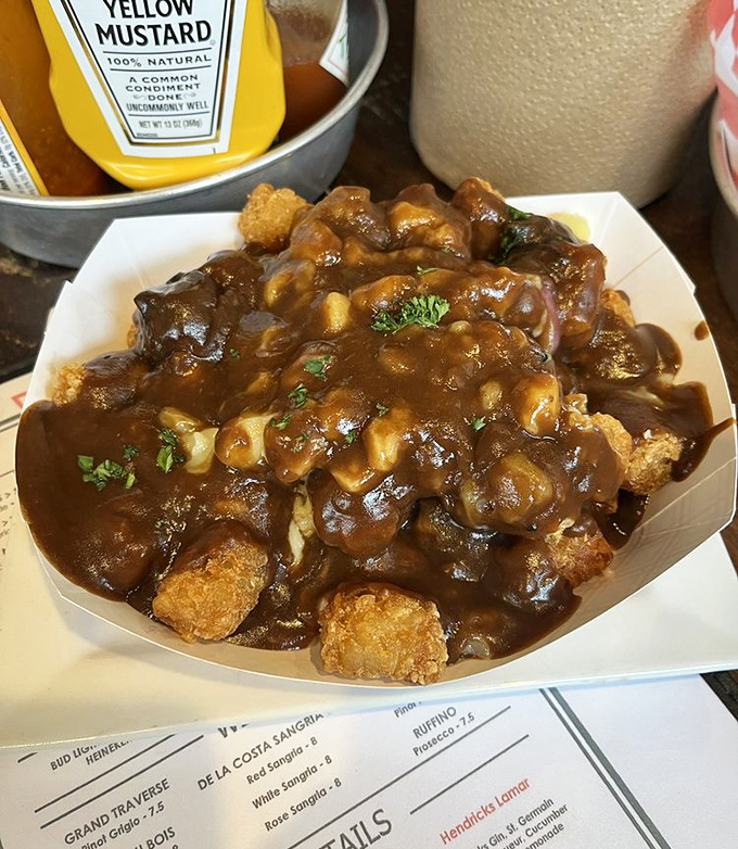 Poutine Tots&mdash;where tater tots meet gravy in a beautiful relationship that would make both Americans and Canadians stand up and salute.