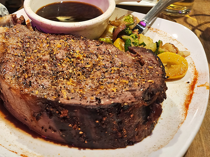 The prime rib&mdash;a masterclass in meat preparation that makes vegetarians question their life choices. That perfect pink center speaks volumes.