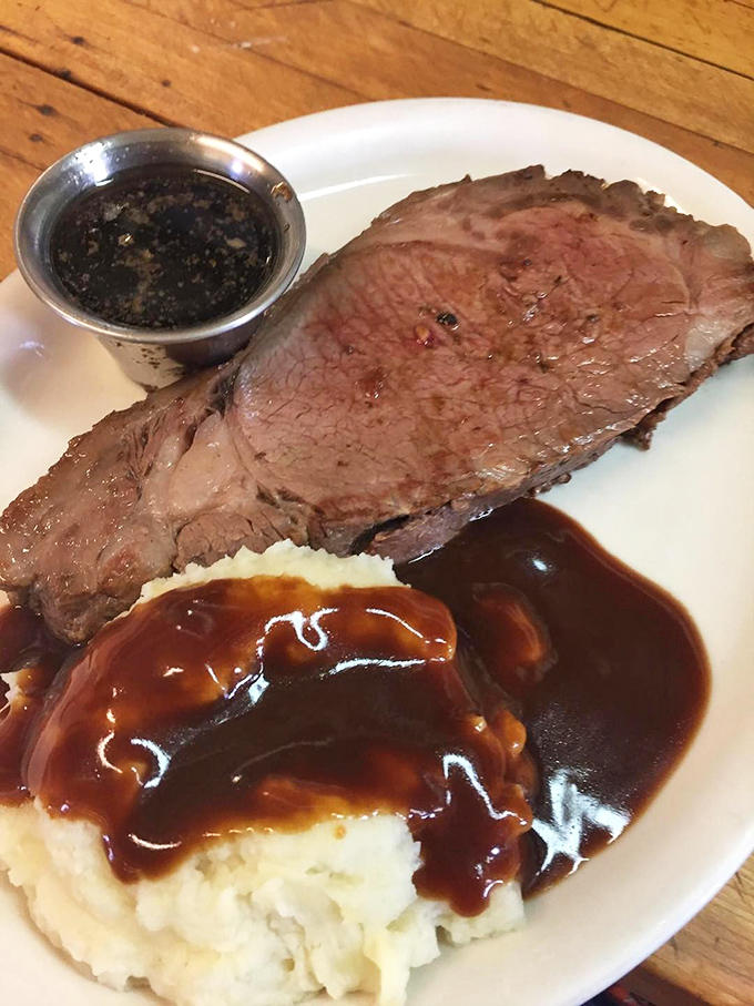 Prime rib so perfectly cooked it makes you wonder if the chef has some sort of meat telepathy, resting majestically beside gravy-kissed mashed potatoes.