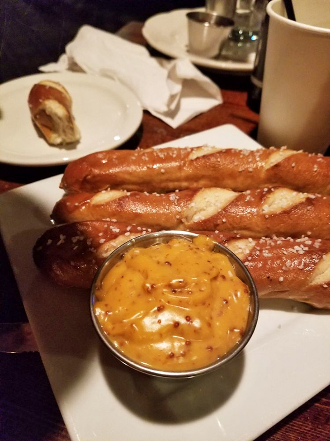 These aren't your ballpark pretzels. Served with mustard that'll clear your sinuses faster than a British weather change, they're the perfect beer companion.