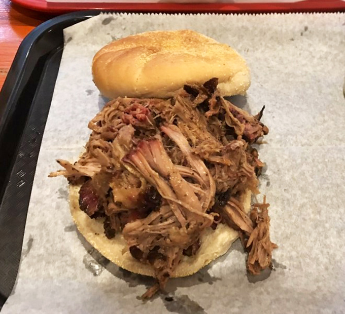 Pulled pork so tender it practically pulled itself. Piled high on a soft bun, this sandwich is what happiness tastes like.