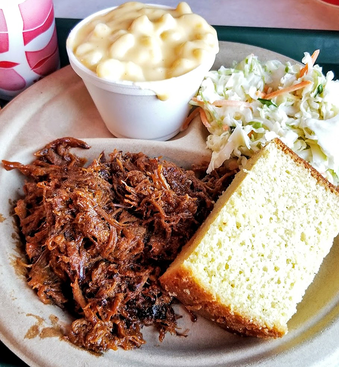 Pulled pork that's been coaxed into tender submission, paired with mac and cheese that could make a cardiologist weep.