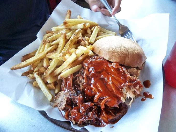 This pulled pork sandwich doesn't just satisfy hunger&mdash;it creates memories. The golden fries are merely supporting actors in this meaty blockbuster.