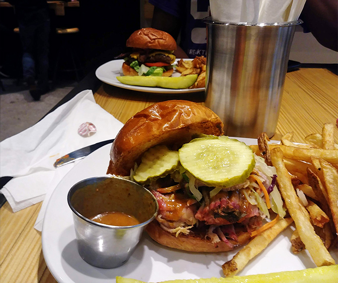 This sandwich is what happens when pulled pork goes to finishing school - refined, stacked, and ready to party.