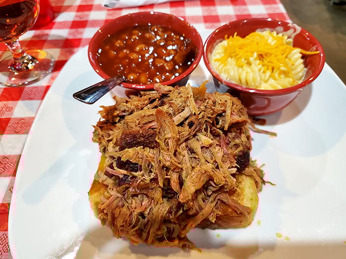 Pulled pork piled high with sides of mac and cheese and baked beans. A holy trinity of comfort that makes you want to hug the chef.