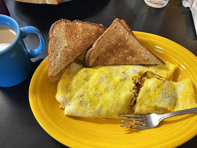 This omelet doesn't just contain pulled pork &ndash; it showcases it like a headliner at a culinary concert, with perfectly toasted bread as the opening act.