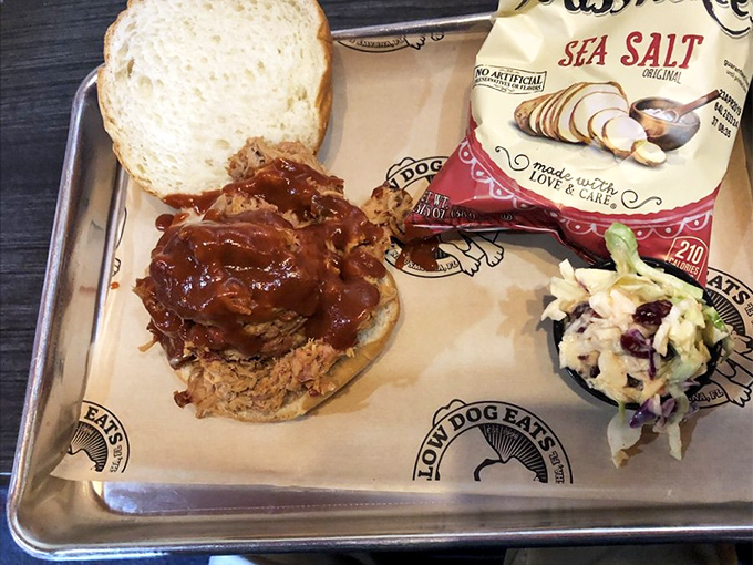 A pulled pork sandwich that doesn't just satisfy hunger &ndash; it creates memories, complete with homemade slaw and kettle chips.