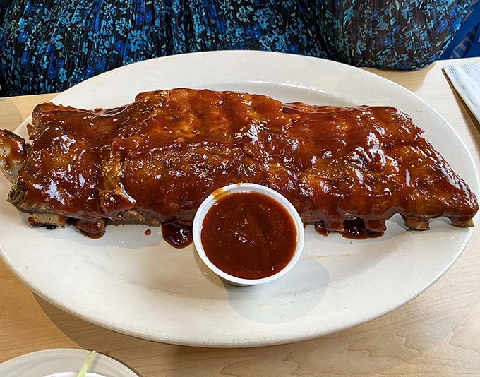 Glistening with sauce and falling off the bone, these ribs don't just satisfy hunger &ndash; they solve all of life's problems temporarily.