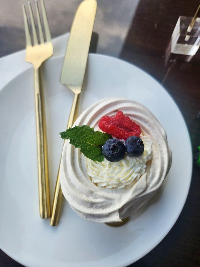 This pavlova doesn't just sit on the plate&mdash;it poses, showing off its perfect meringue swirls and berry crown like it knows how good it looks.