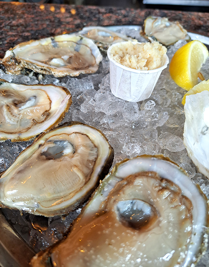 Fresh oysters on the half shell, served with a lemon wedge and horseradish&mdash;nature's perfect appetizer just waiting for a splash of mignonette.