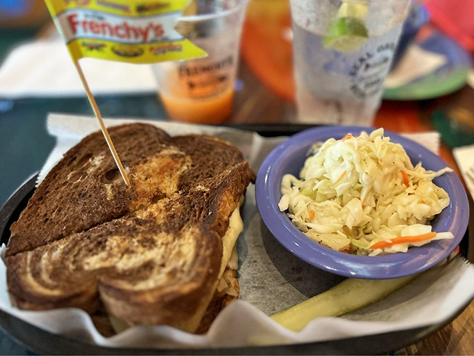 The Reuben got a Florida makeover! Marble rye embracing grouper instead of corned beef—a sandwich identity crisis that works surprisingly well.