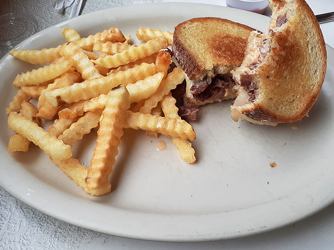 A proper Reuben with crispy fries &ndash; proof that the best relationships are the ones with a little tang, a little heat, and plenty of cheese.