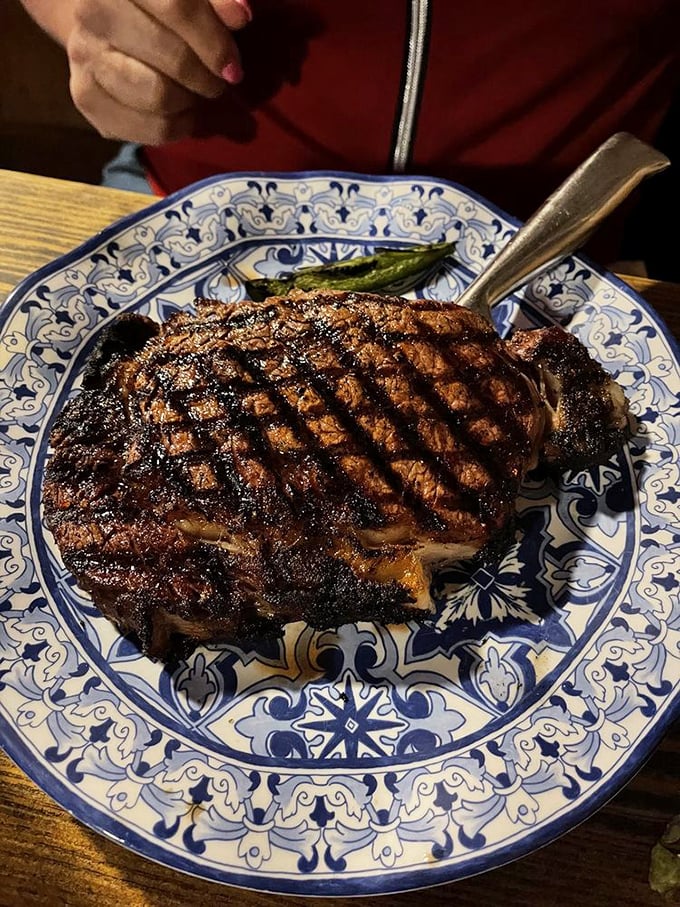 This isn't just a ribeye; it's a masterclass in meat preparation, with grill marks so perfect they deserve their own Instagram account.