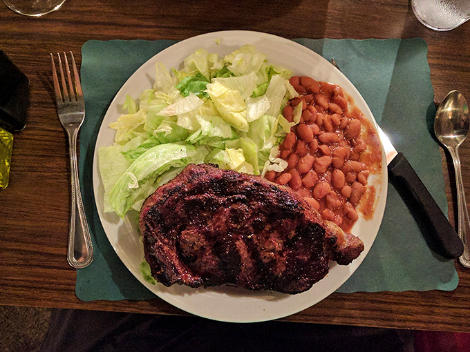 A ribeye with a crust that should be in the Louvre. The kind of steak that makes conversation stop and eyes roll back in pure pleasure.