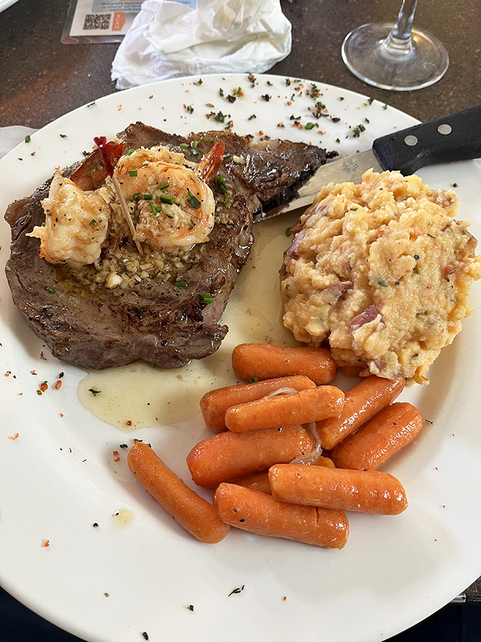 A steak topped with shrimp that answers the eternal question: "Surf or turf?" with a definitive "Why choose when you can have both?"