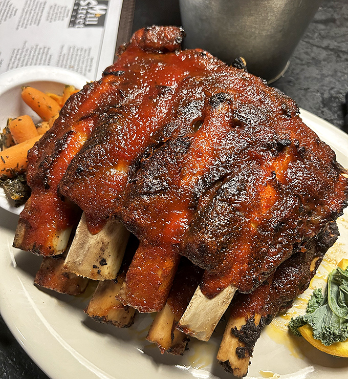 These ribs aren't just falling off the bone&mdash;they're practically jumping into your mouth, glazed with a sauce that balances sweet, tangy, and smoky in perfect harmony.