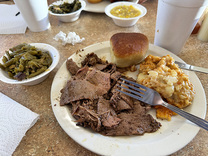 Roast beef that surrenders at the mere suggestion of a fork, alongside green beans and mac and cheese that refuse to be overshadowed.
