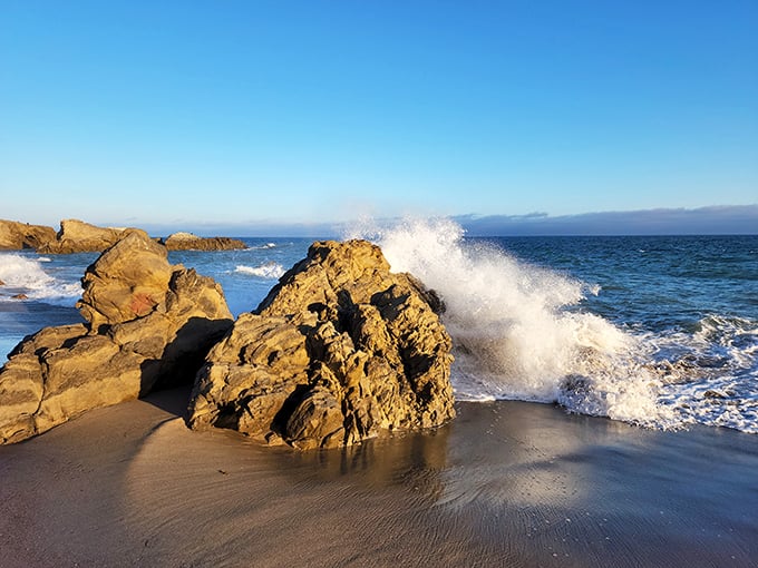 Mother Nature's abstract sculpture garden, where waves perform their endless ballet against golden rocks warmed by the California sun.