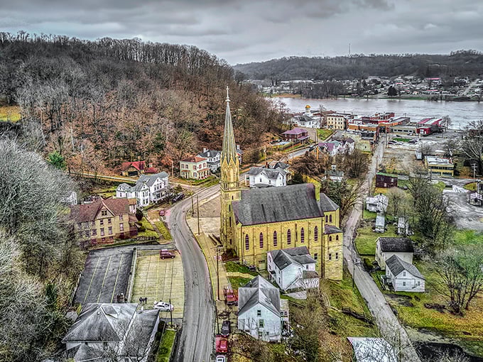 This aerial view reveals Pomeroy's unique geography&mdash;a town squeezed between river and hills, with a golden church spire reaching skyward.