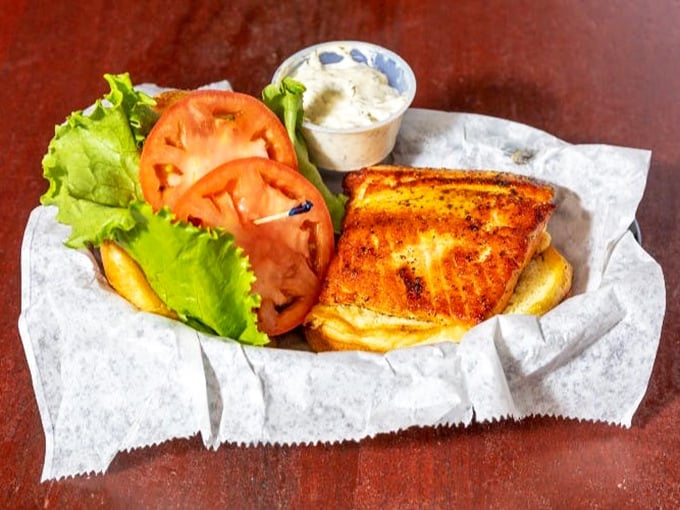 This salmon sandwich proves Blue Moon isn't just about fried indulgences&mdash;fresh lettuce, tomato and perfectly grilled protein create a lighter option that doesn't sacrifice flavor.